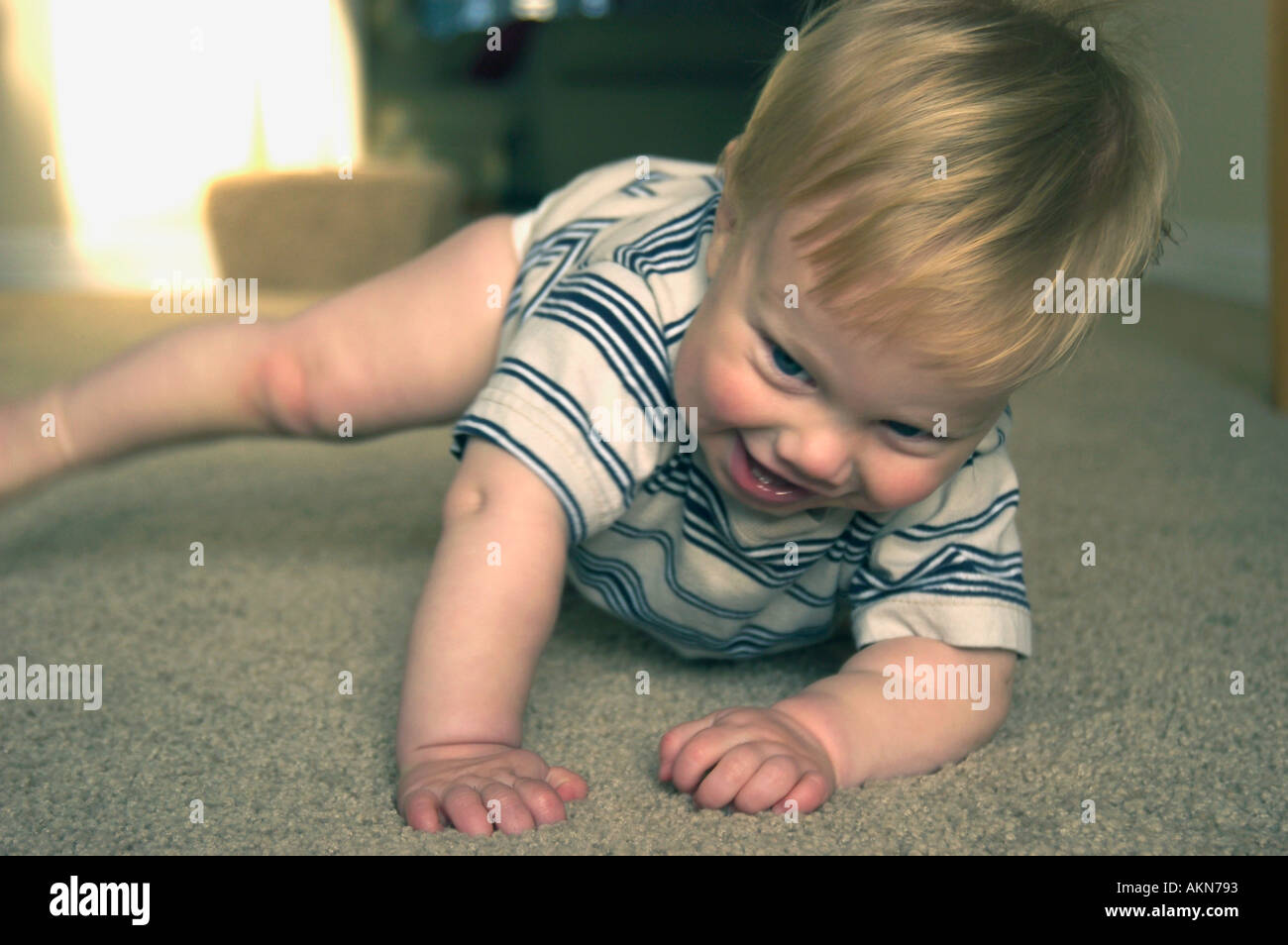 crawling baby losing balance Stock Photo - Alamy
