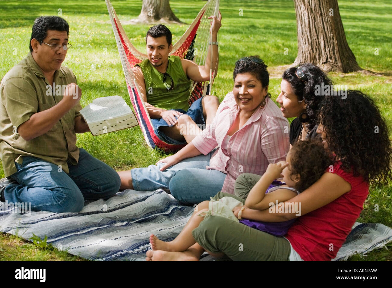 Family Bible study Stock Photo - Alamy