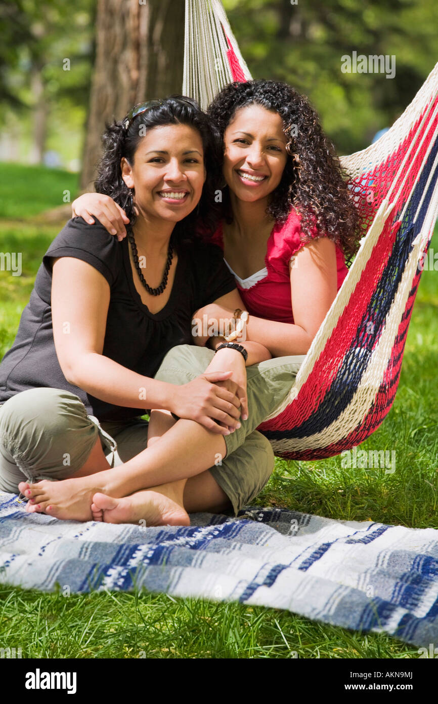Two women sitting together Stock Photo - Alamy