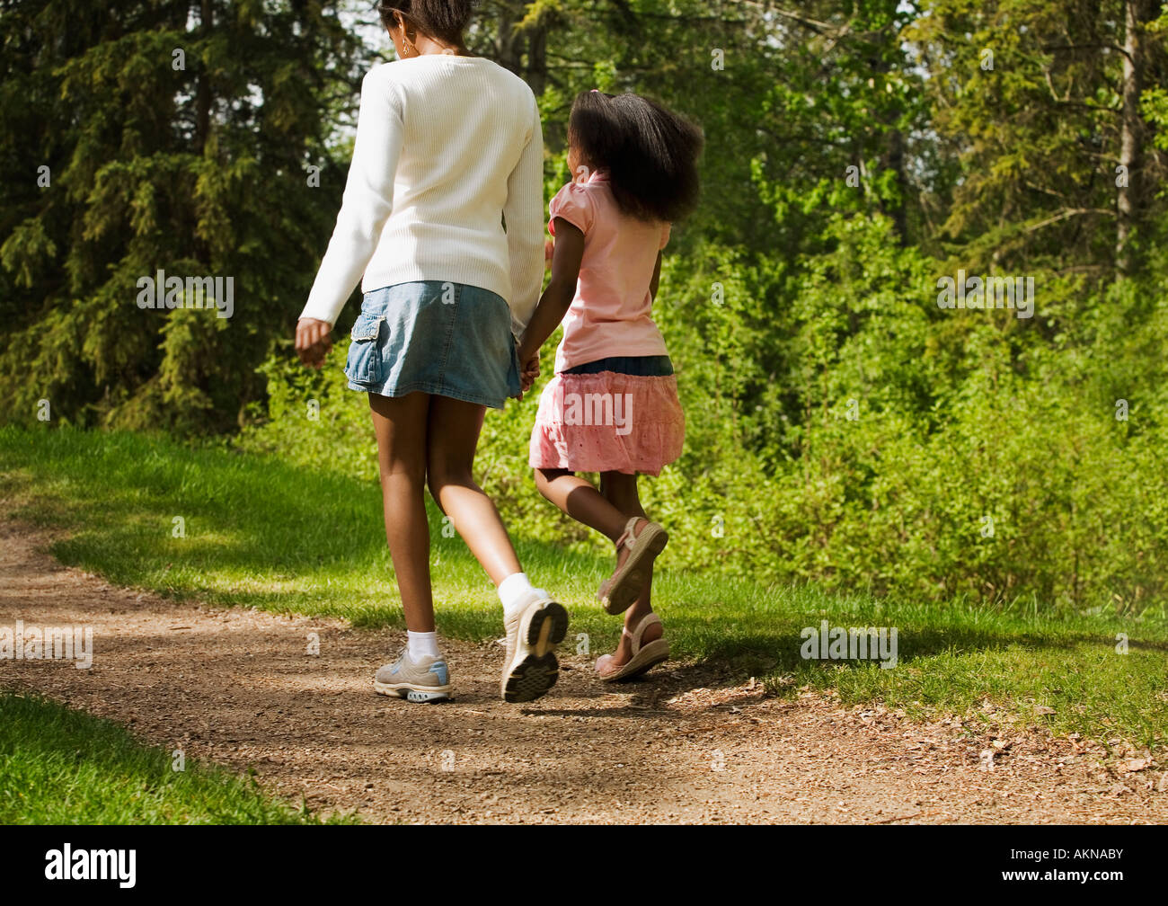 Two girls going for a walk Stock Photo - Alamy