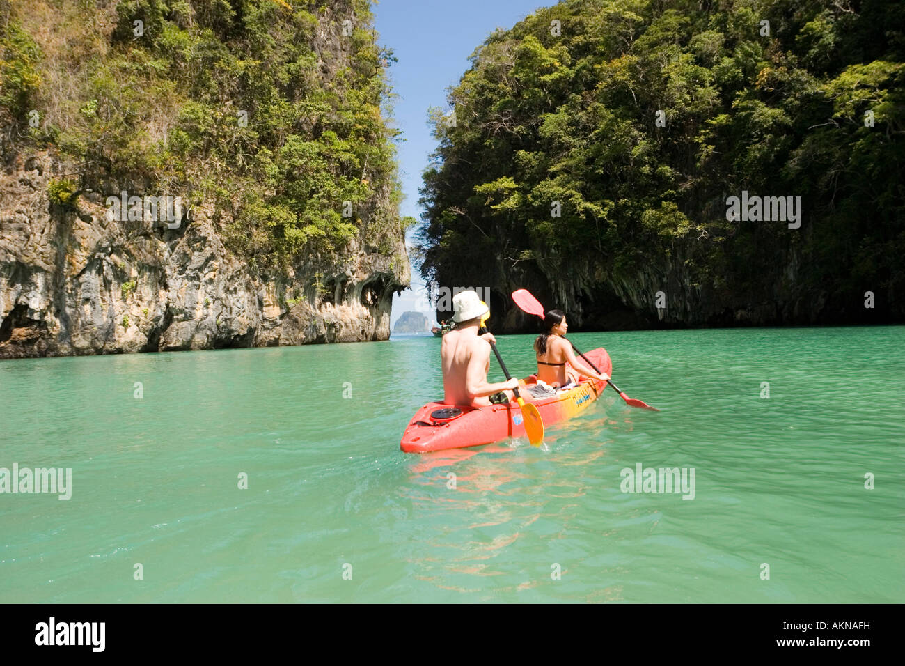 Couple kayaking Ko Hong Island lagoon Phang Nga bay Krabi Thailand one ...