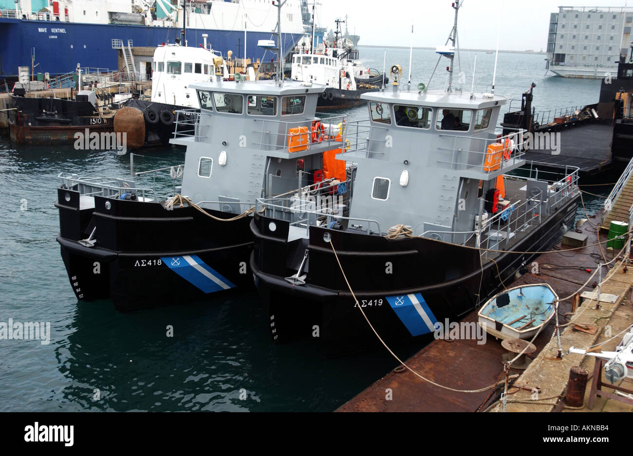Oil pollution clean up boats Stock Photo - Alamy