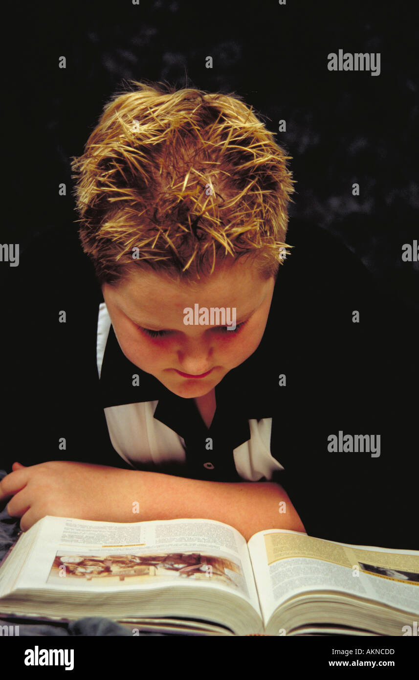 Junior High Boy Reading Stock Photo - Alamy