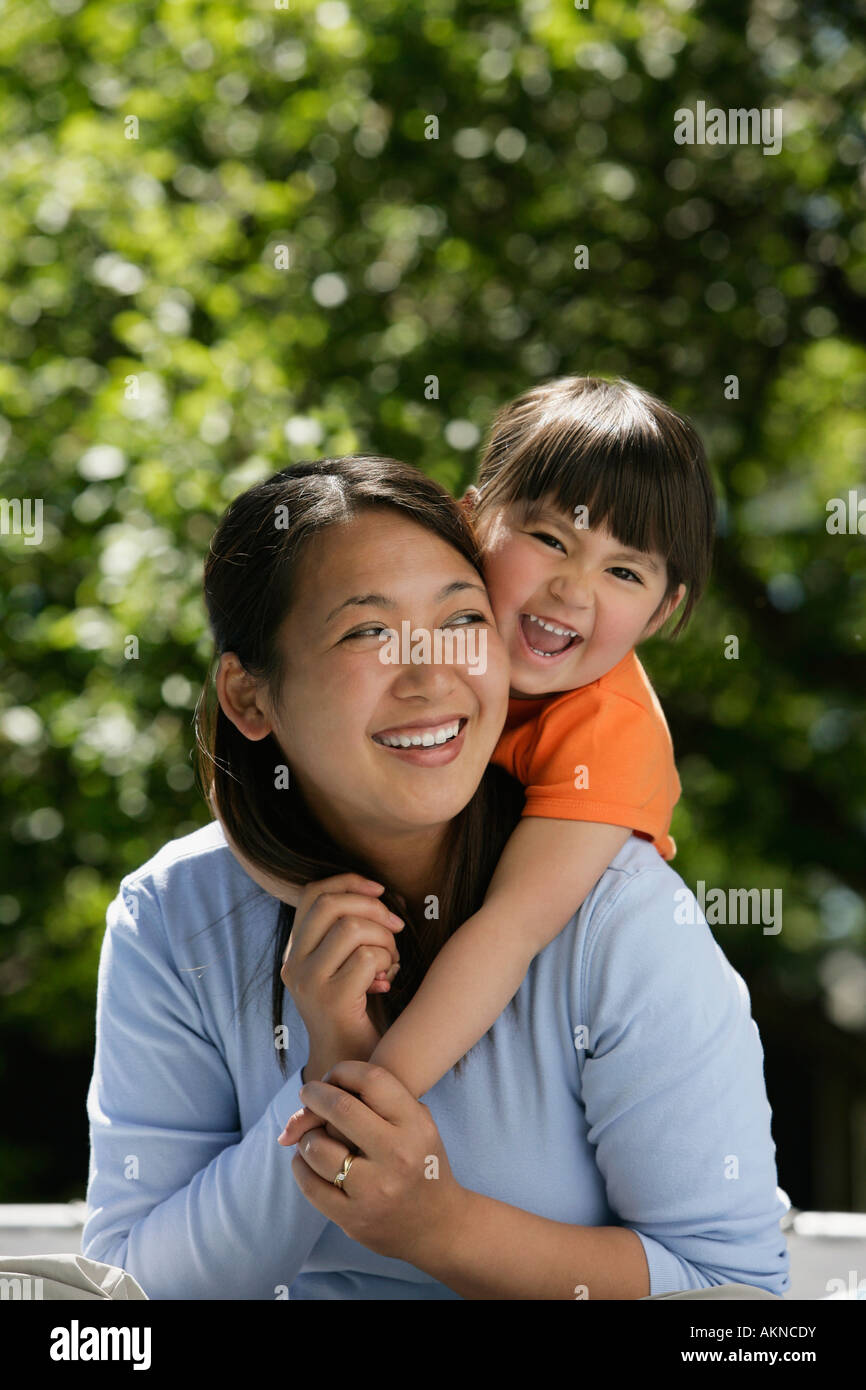 Mother and daughter hugging Stock Photo - Alamy