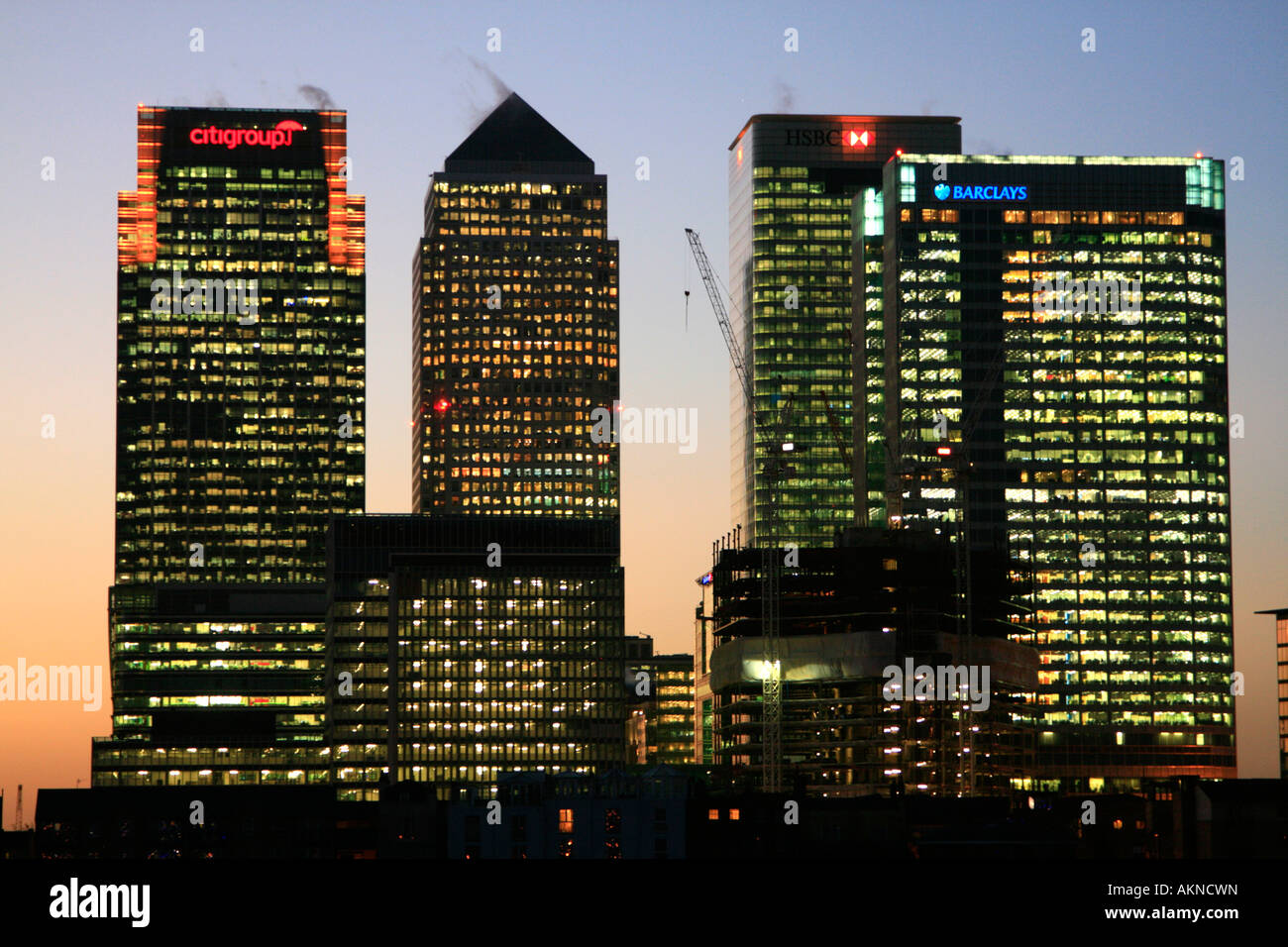 citicorp, no 1 canada square, hsbc, barclays bank hq office buildings at dusk illuminated canary ...