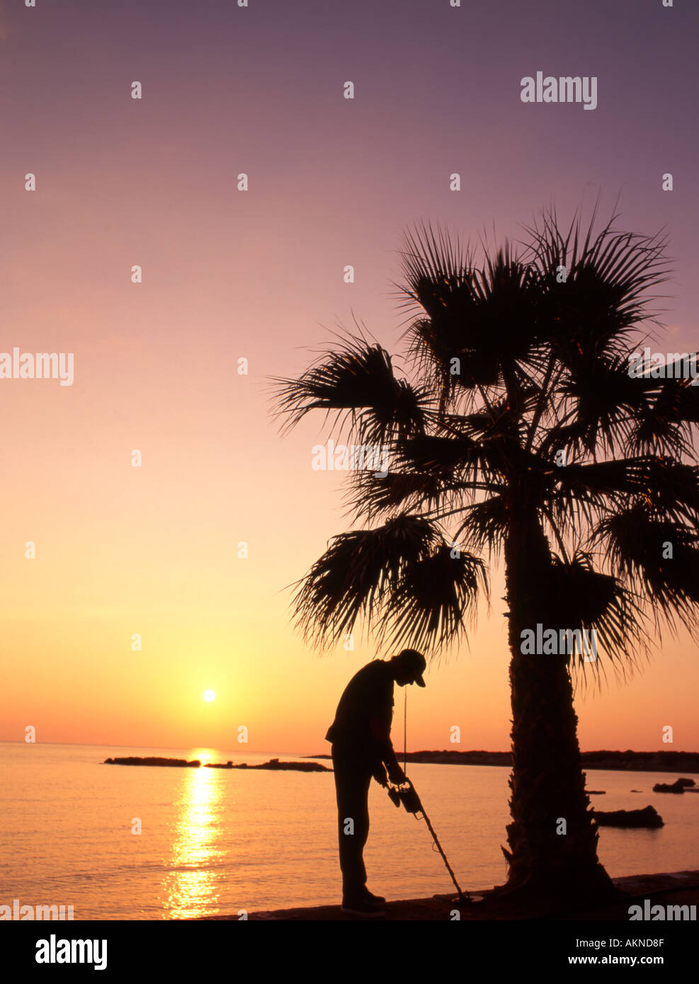 Metal detecting treasure hunting on Mediterranean Beaches Stock Photo ...