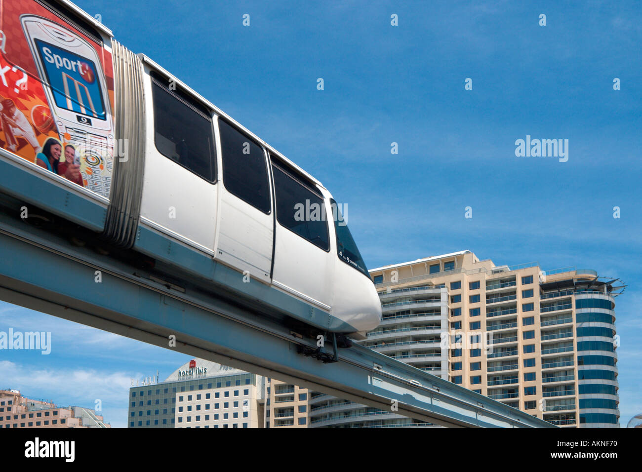 Monorail crossing over Pyrmont Bridge with hotels behind, Darling ...