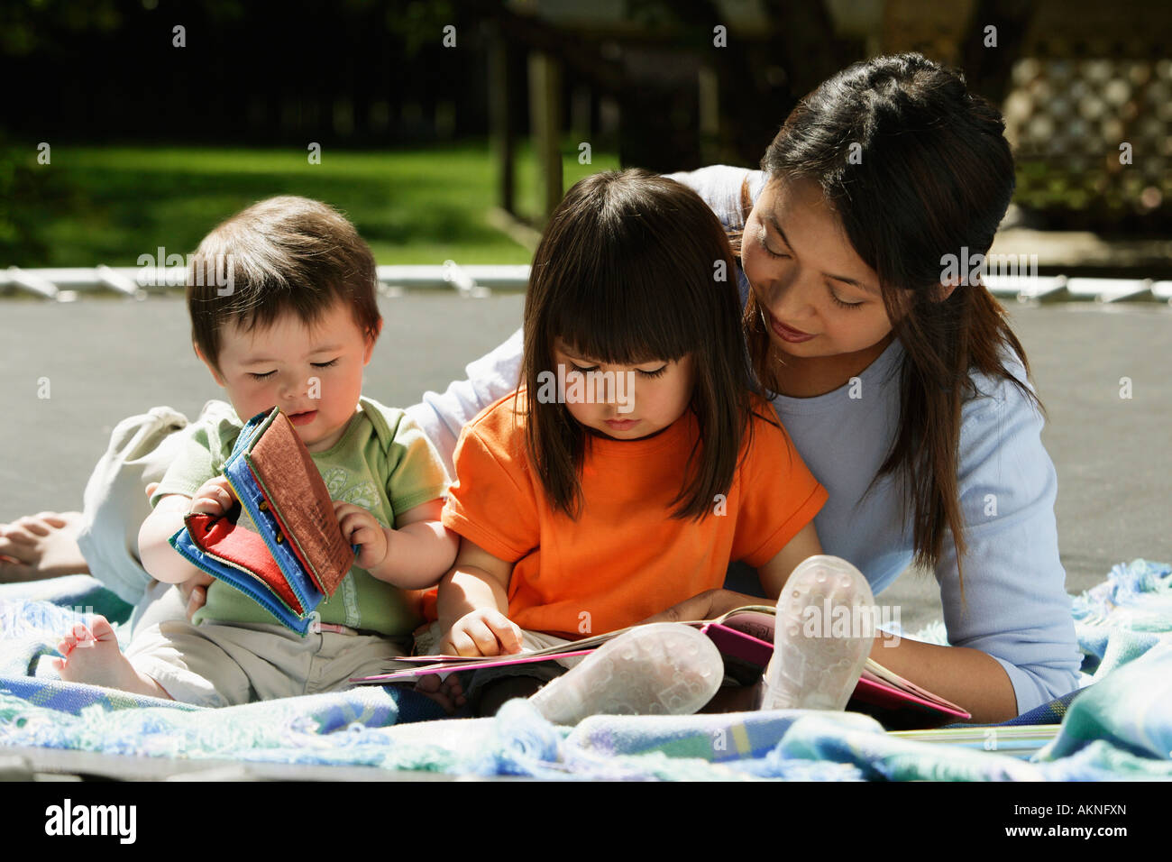 A mother reading to her children Stock Photo - Alamy