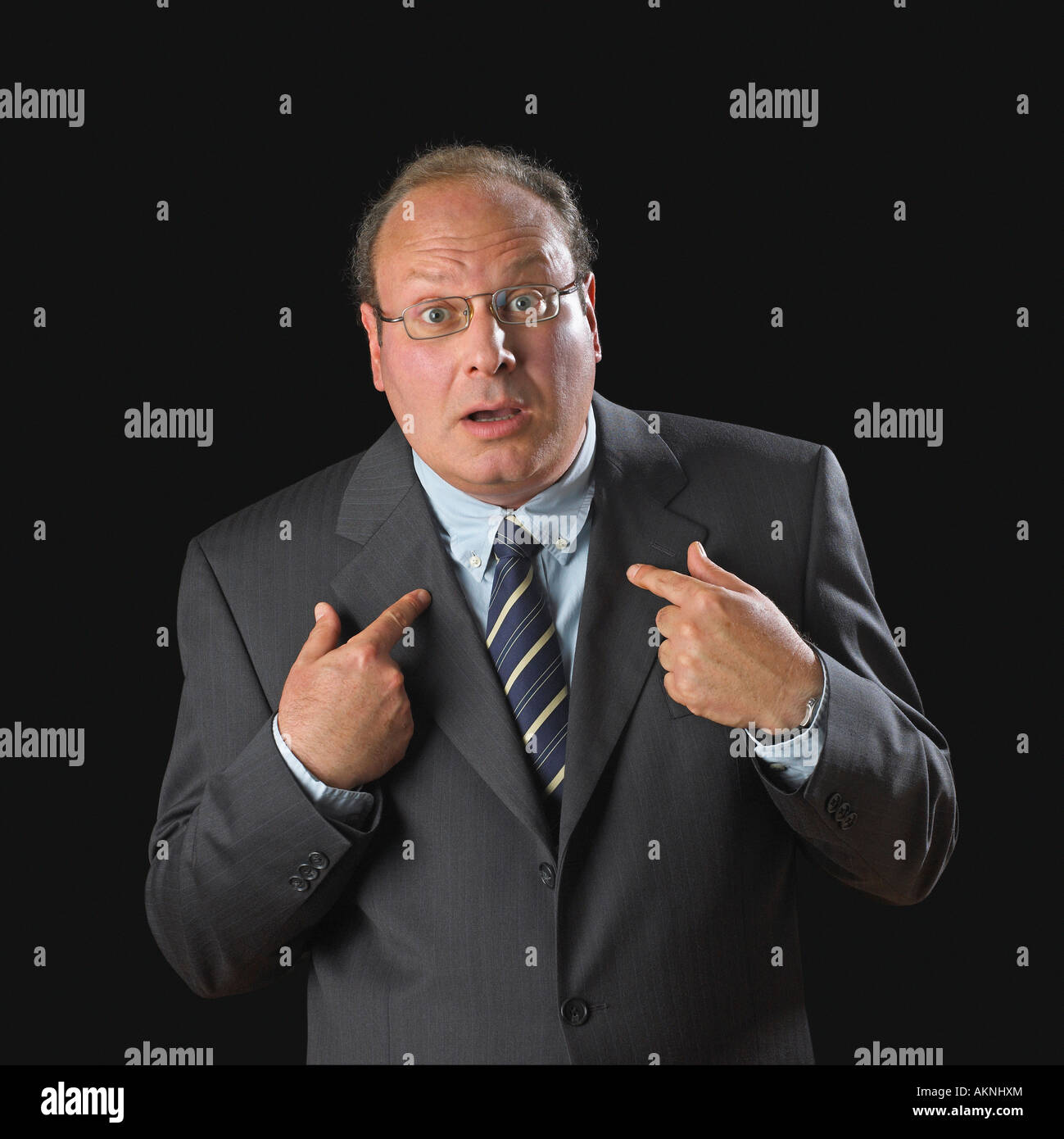 Image of middle age caucasian man in suit looking surprised pointing at ...