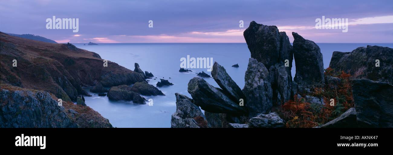 dawn on the cliffs above Warren Cove with the Dancing Beggars and the ...