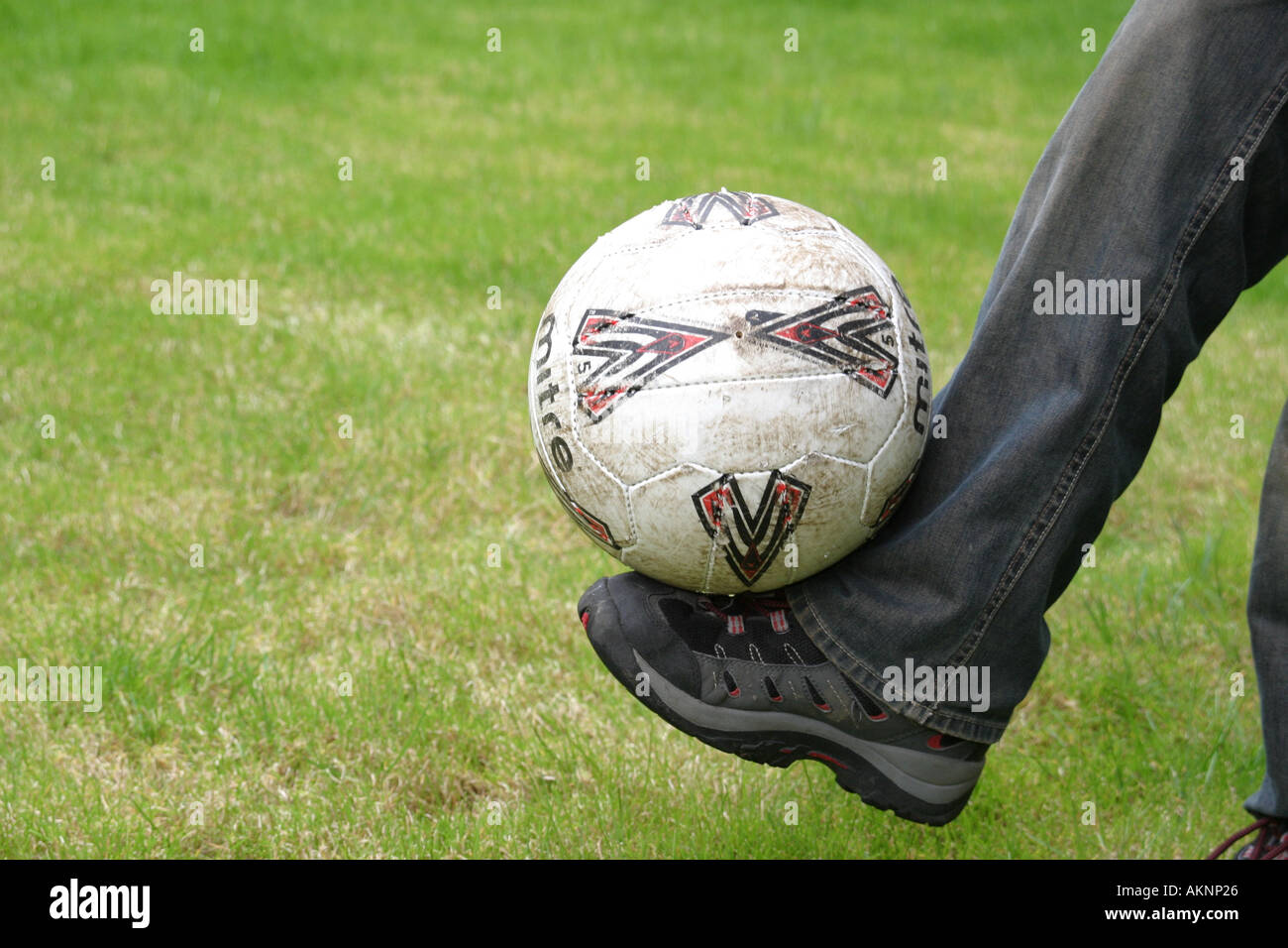 boy controlling a football on his foot Stock Photo - Alamy