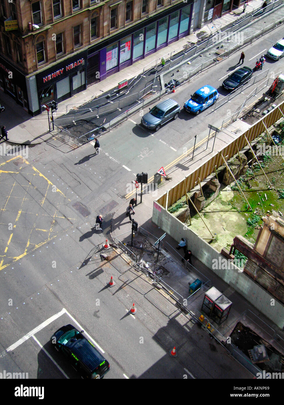 Overhead birds eye view of pedestrians and traffic at city centre ...