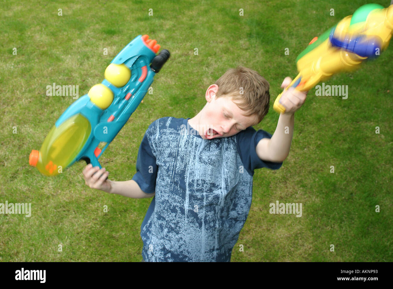 boy playing with water guns Stock Photo - Alamy