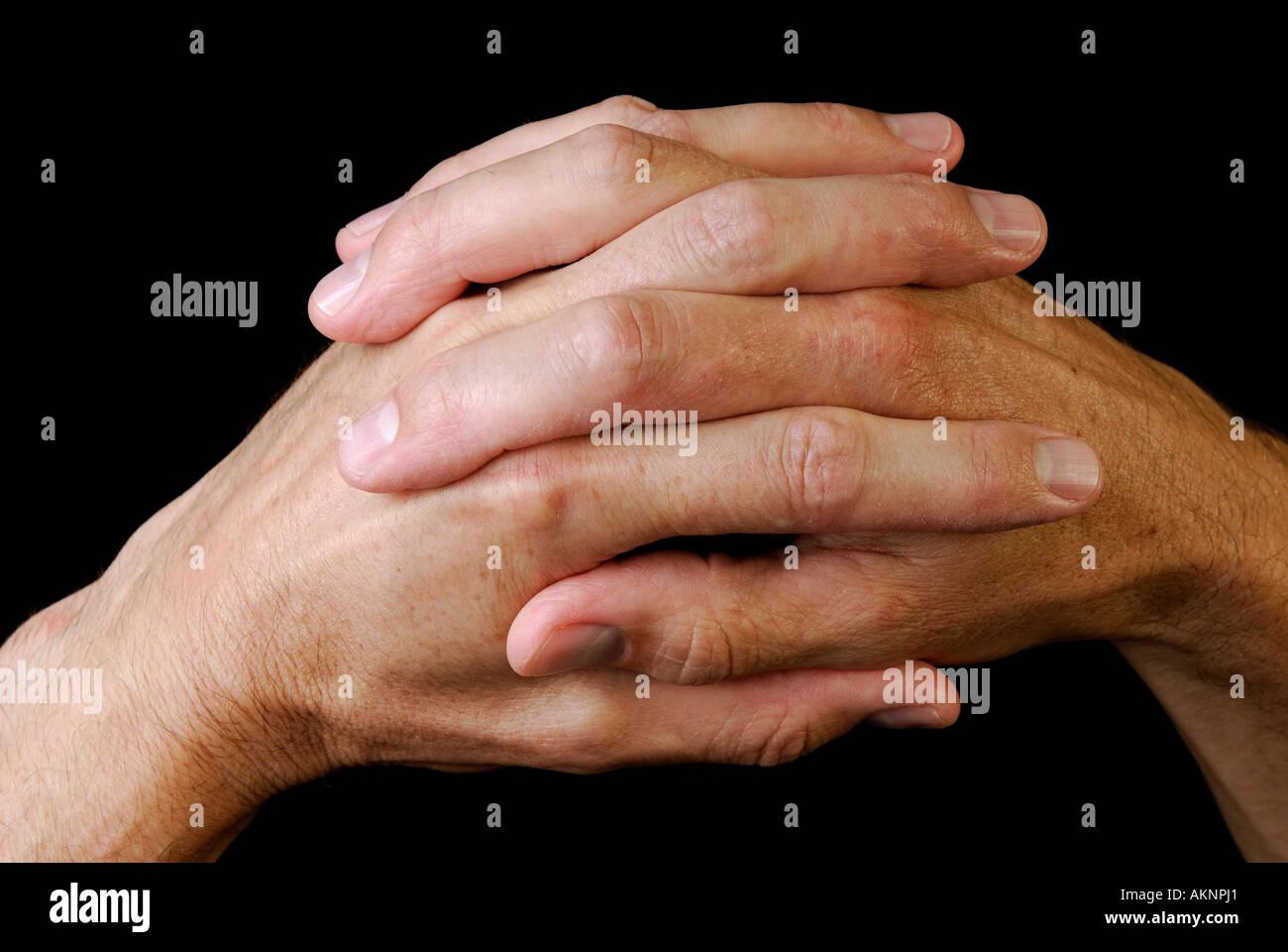 Old clasped hands hi-res stock photography and images - Alamy