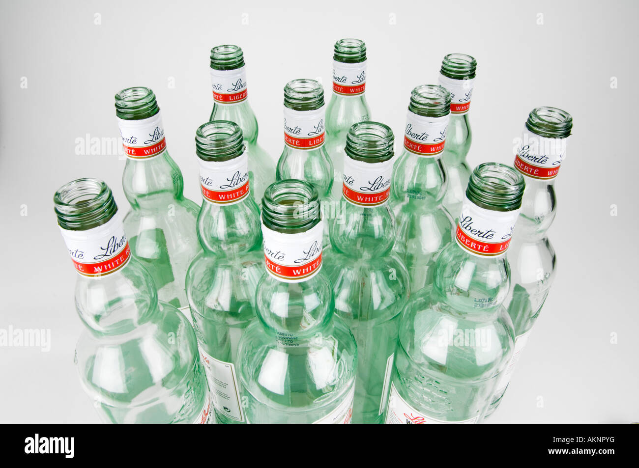 A group of empty spirit bottles on a white background Stock Photo - Alamy