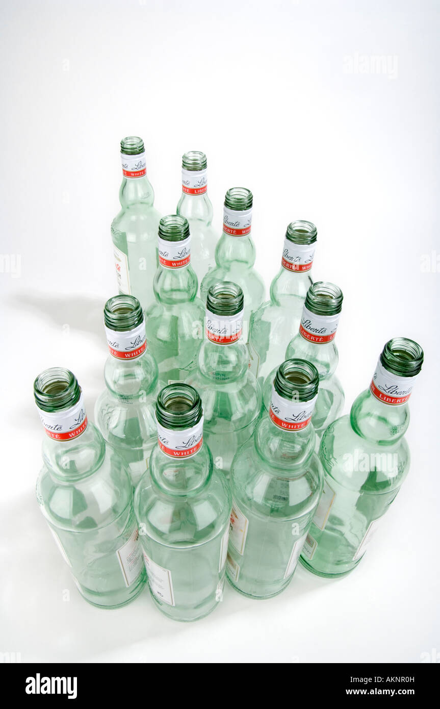 A group of empty spirit bottles on a white background Stock Photo - Alamy