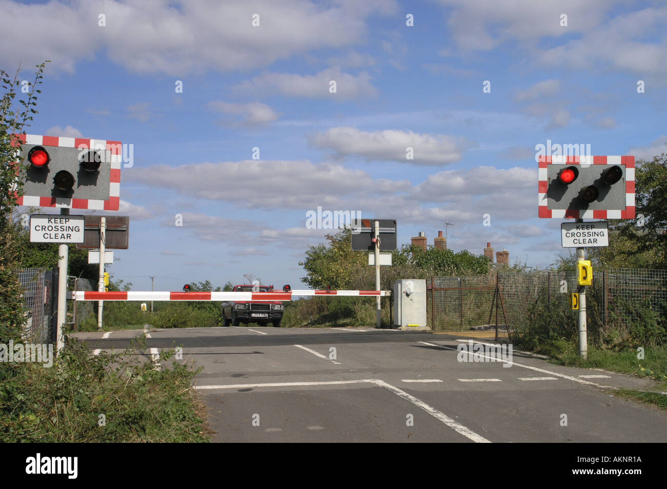 Automated unmanned railway crossing Stock Photo - Alamy