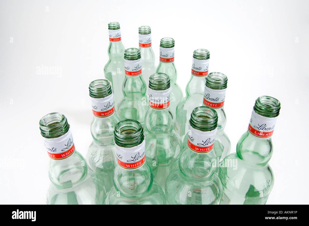 A group of empty spirit bottles on a white background Stock Photo - Alamy