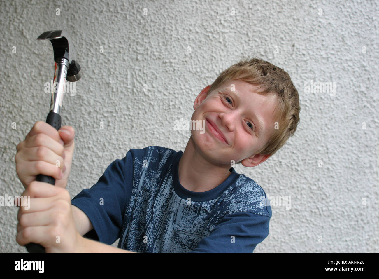 boy holding a hammer Stock Photo - Alamy