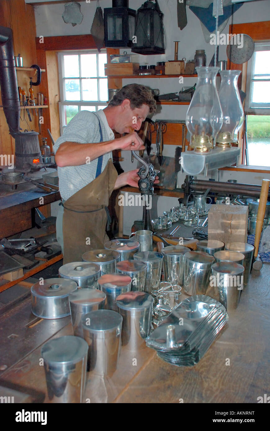 tinsmith at work in 19th centuary workshop Stock Photo - Alamy