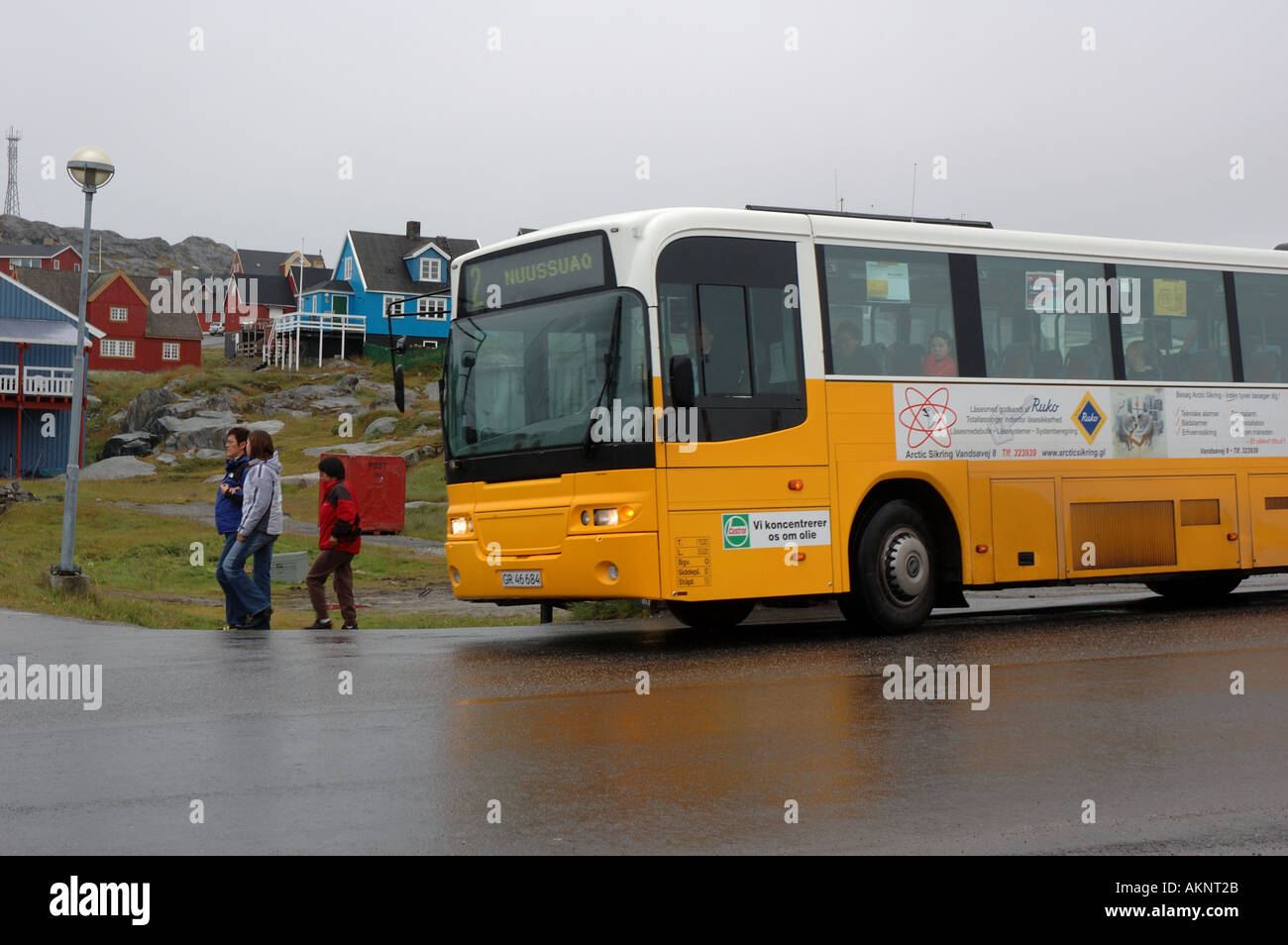 Bus dropping off passengers at a stop in Nuuk Greenland Stock Photo - Alamy