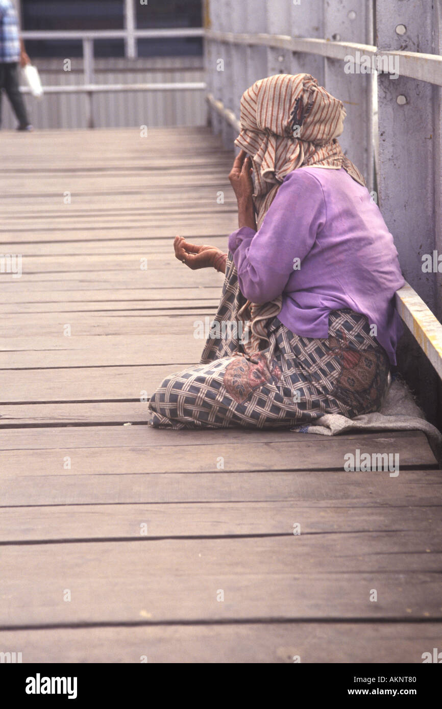 Homeless girl begging in street hi-res stock photography and images - Alamy