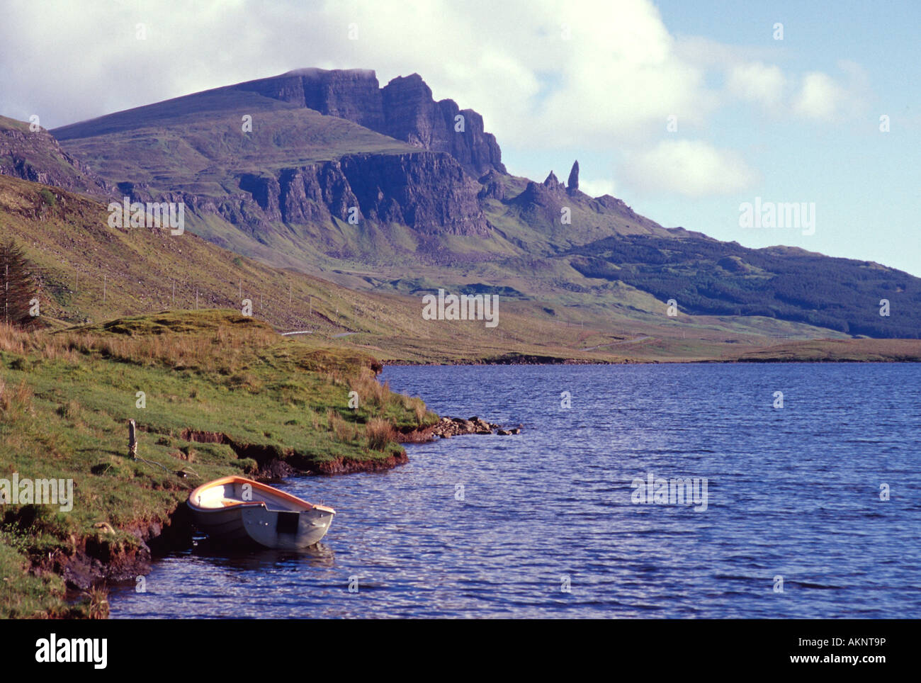 The Old Man of Storr rowing boat on loch isle of skye scotland uk gb ...