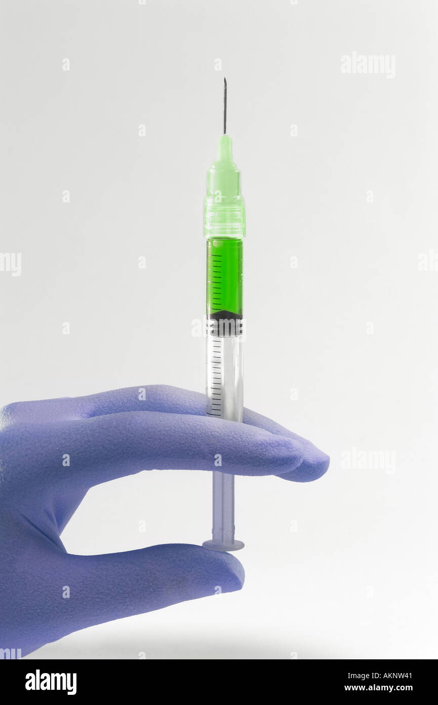 Gloved Hand Holding Needle Stock Photo - Alamy