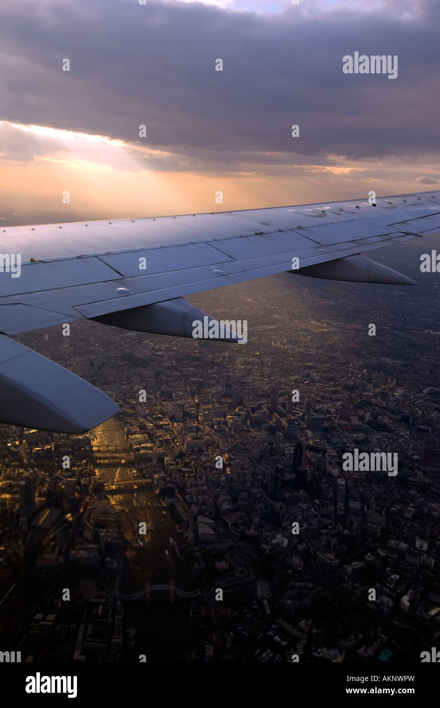 Passenger airliner flying over London United Kingdom Stock Photo - Alamy