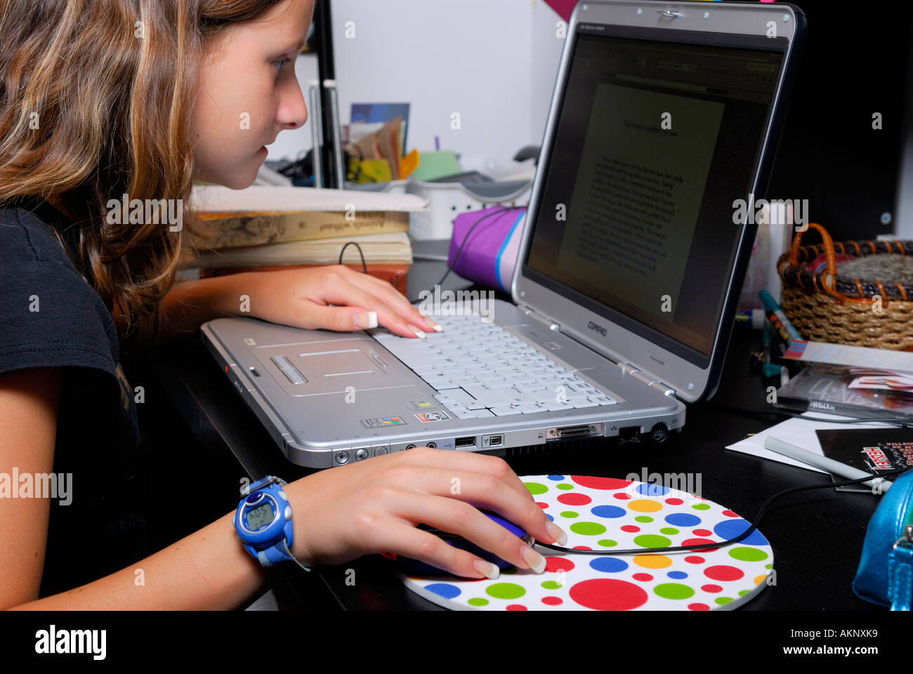 Young girl doing homework in her bedroom on a computer laptop Stock ...