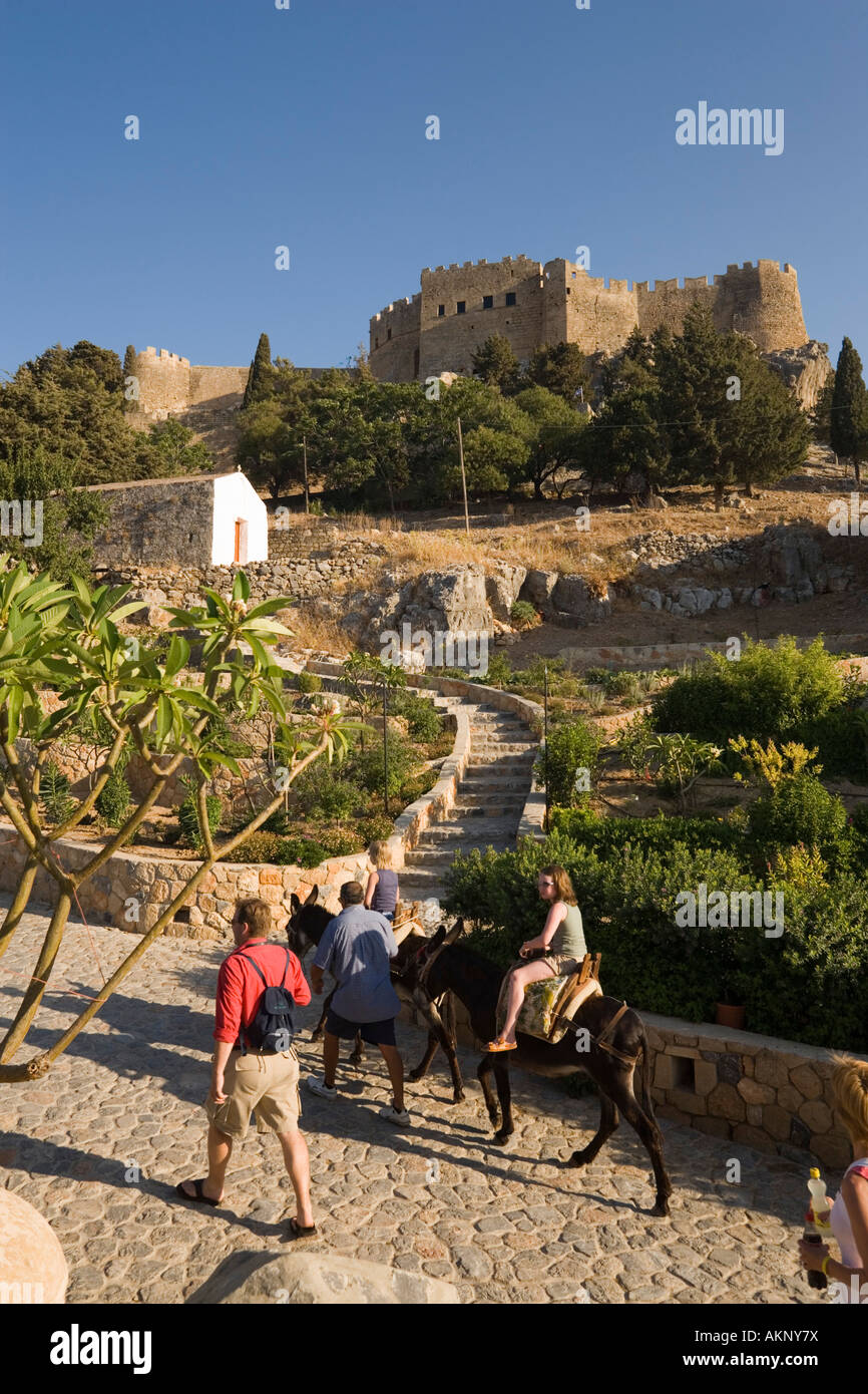 Tourists riding on donkeys to Acropolis Lindos Rhodes Greece Stock ...