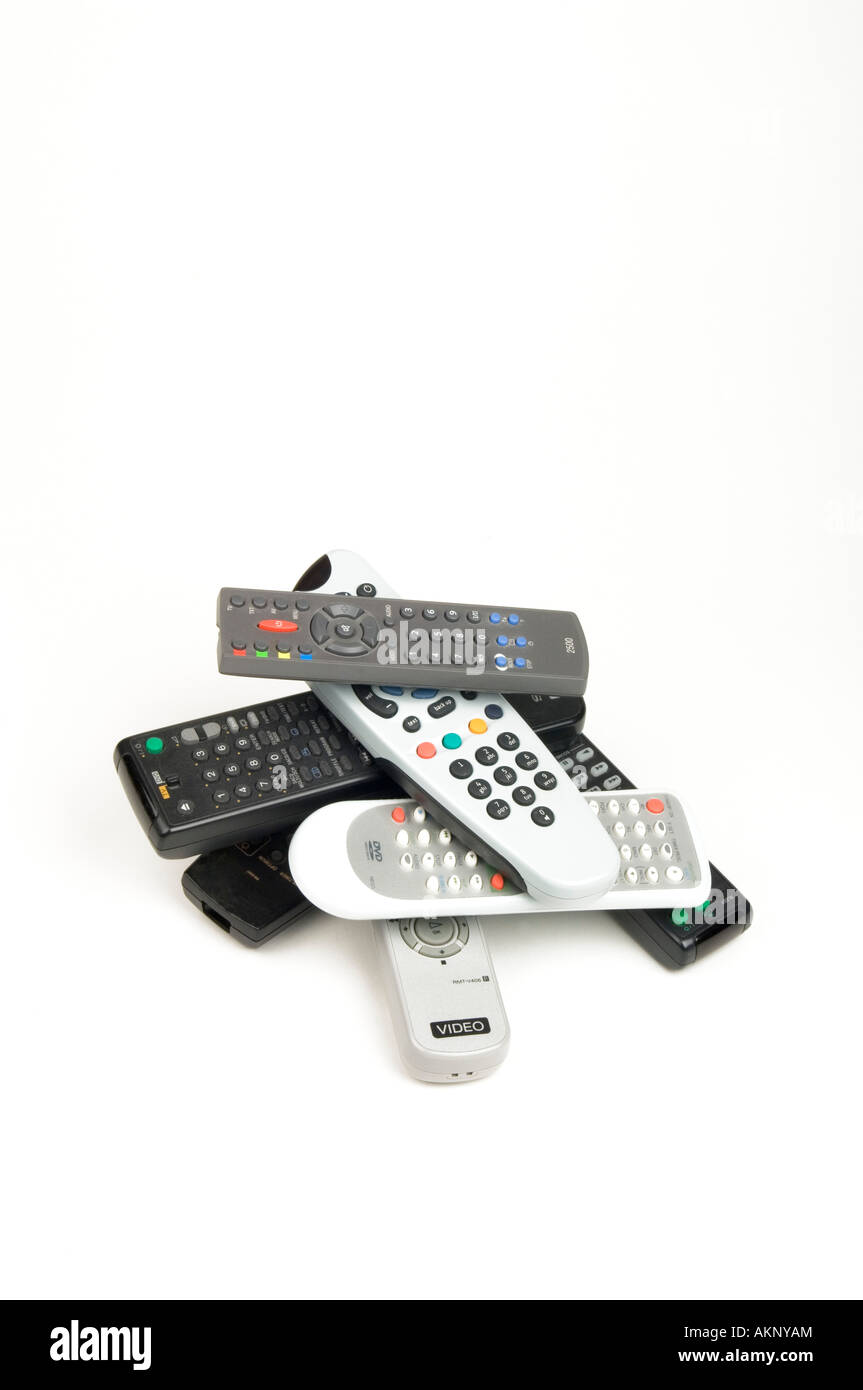 A collection of remote control units to control TV, audio and DVD units ...