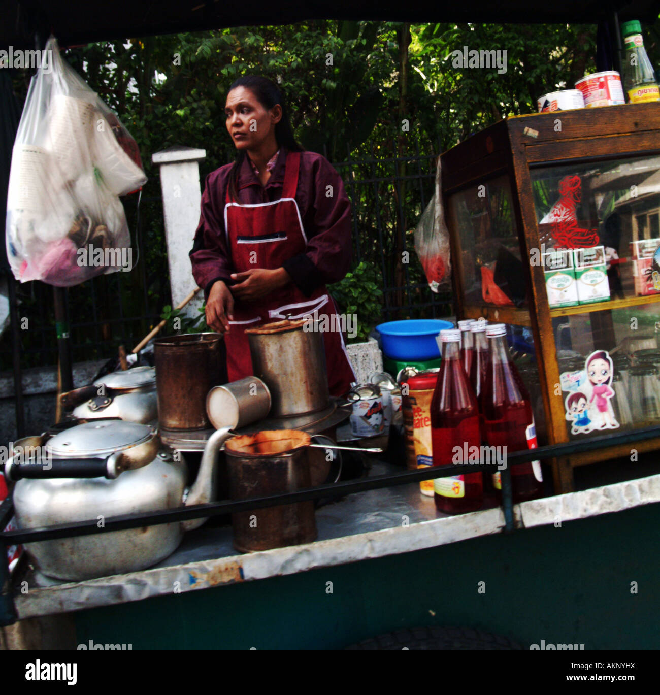 A woman selling noodles on a street in Bangkok Thailand Stock Photo - Alamy