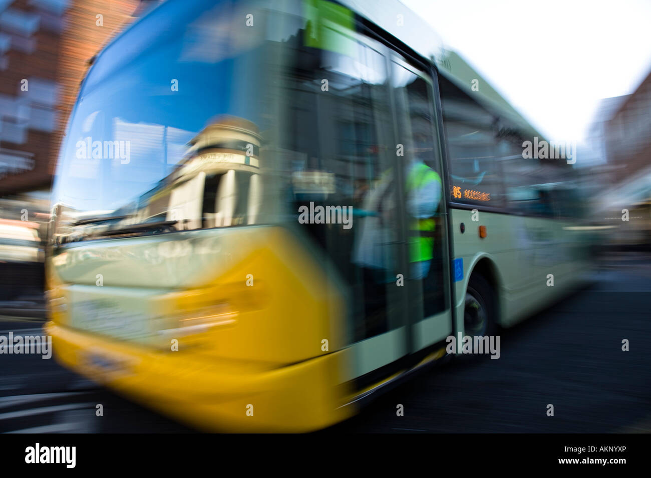A bus negotiating a bend in Guildford town centre, Surrey, England ...