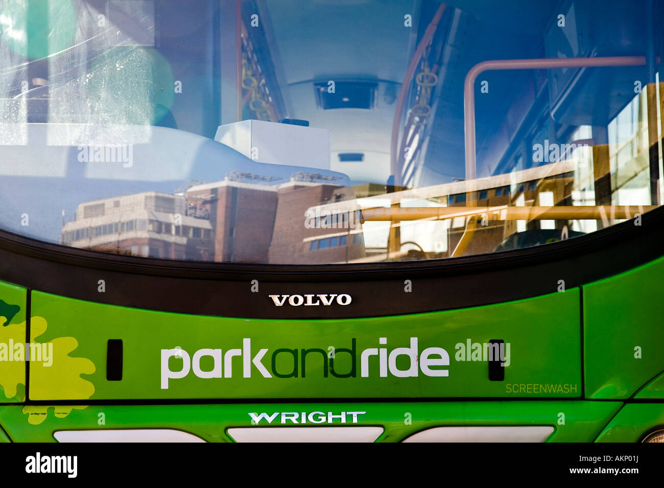 Reflections of buildings in a bus window at the bus station in ...
