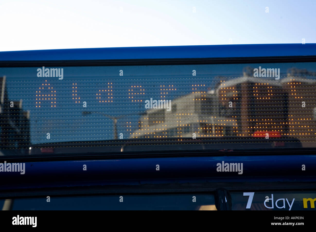 Reflections of buildings in a bus destination screen at the bus station ...