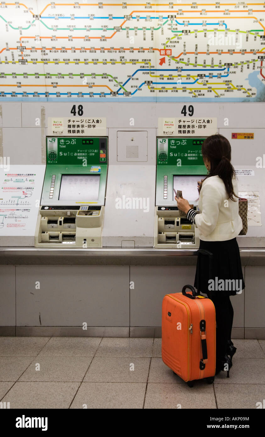 "A commuter buying a train ticket at a JR Station Shinjuku Tokyo Japan ...