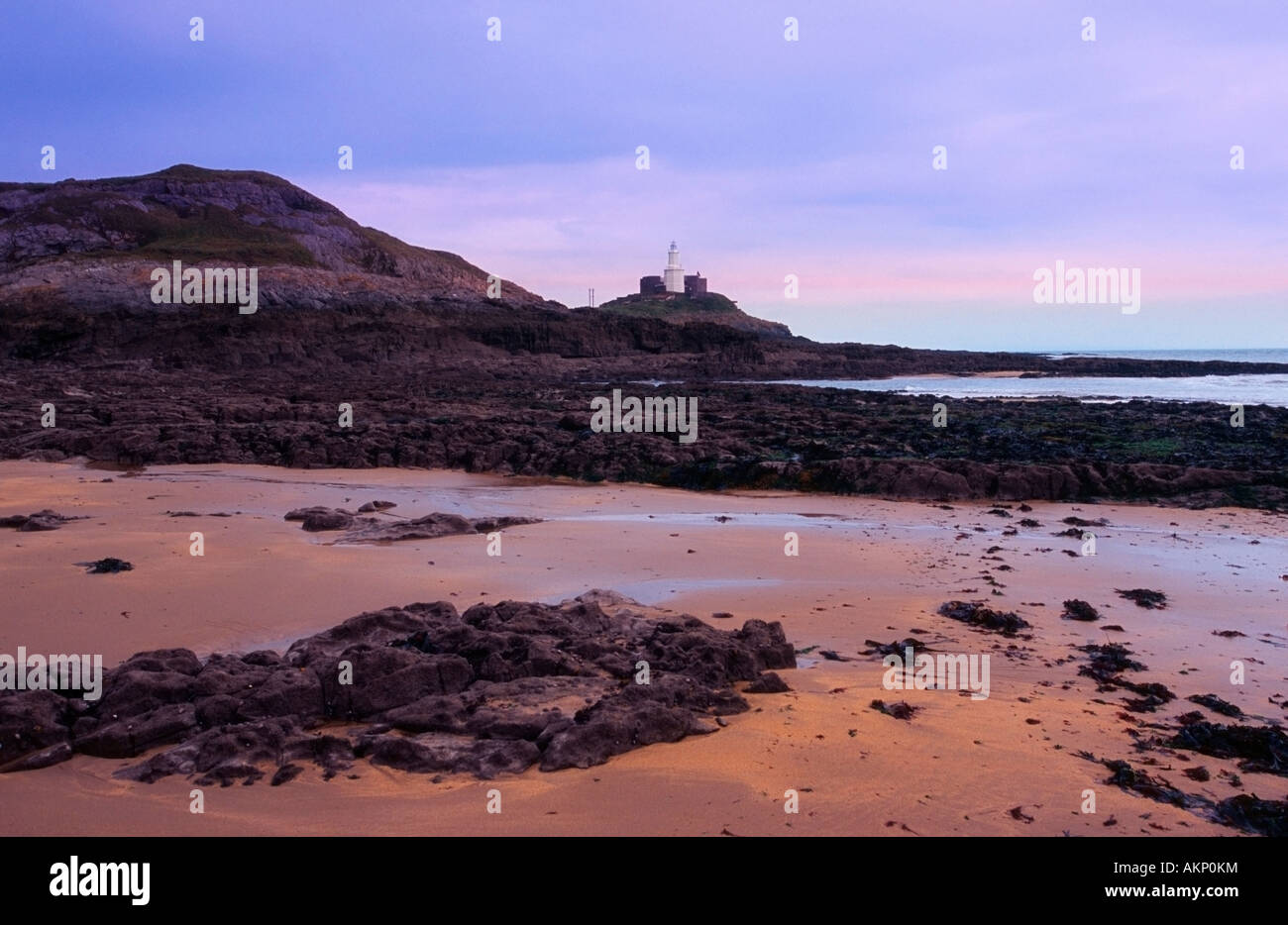 LIGHT HOUSE AT MUMBLES HEAD FROM BRACELET BAY THE GOWER SOUTH WALES UK ...