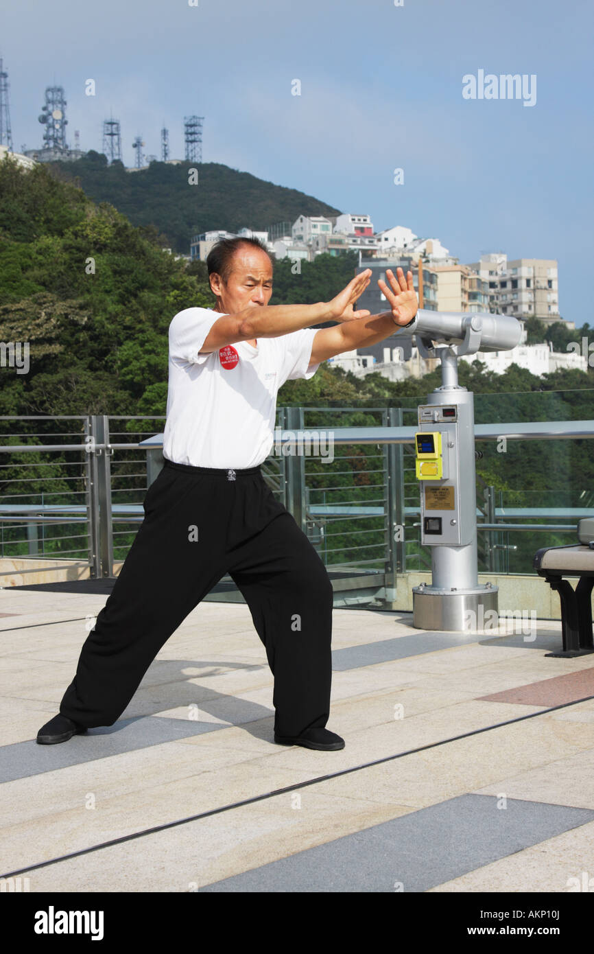 Man Practicing Tai Chi At The Peak Hong Kong Stock Photo - Alamy