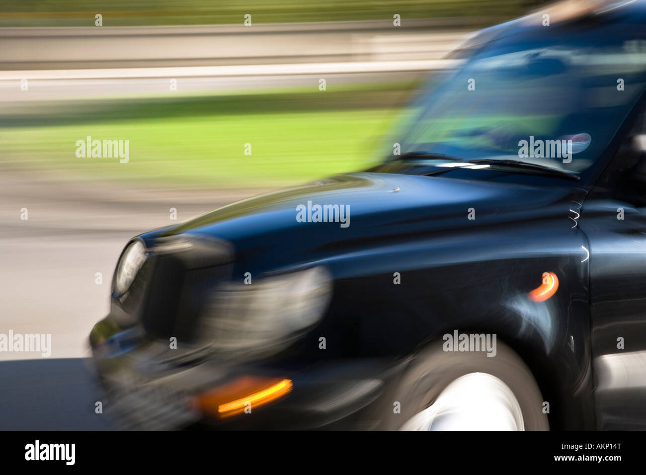 A London black cab taxi negotiating a roundabout, London, England Stock ...