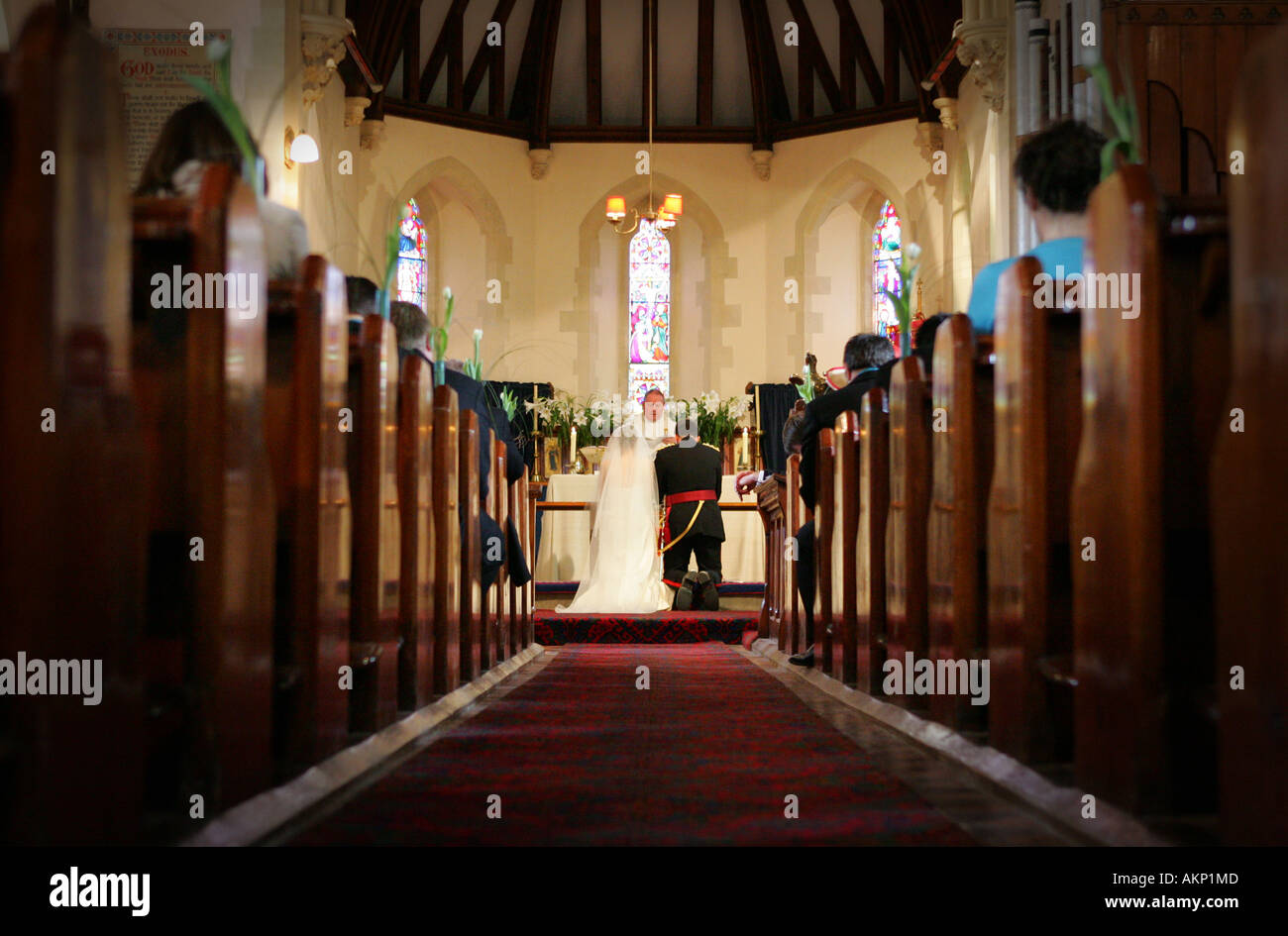 Bride groom kneel altar during hi-res stock photography and images - Alamy