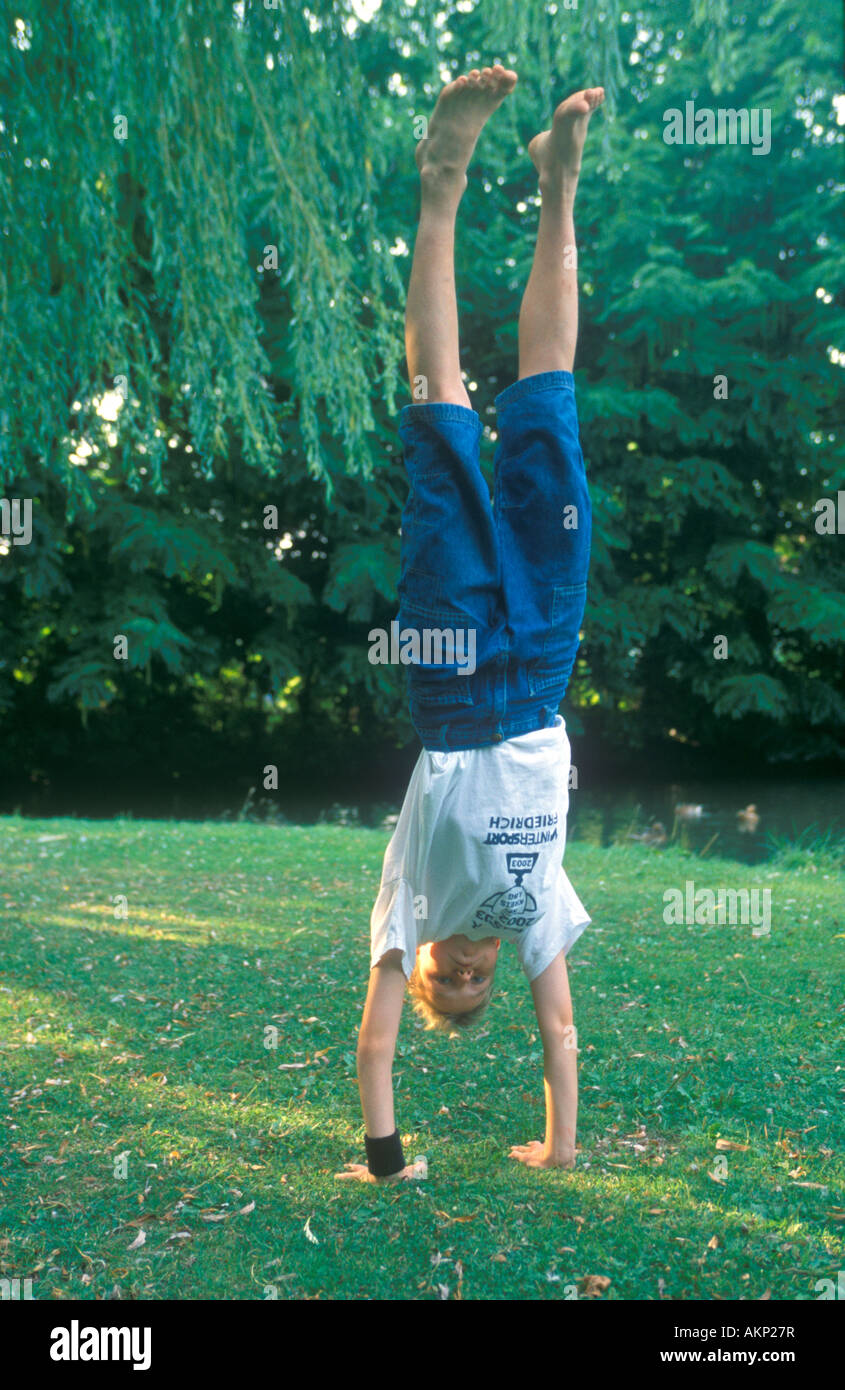young boy doing a handstand Stock Photo - Alamy