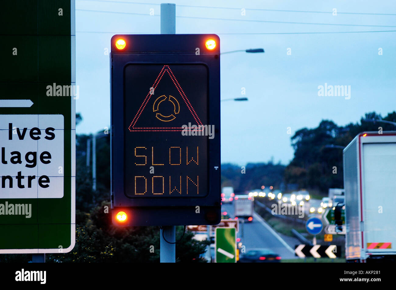 Reactive road sign warning of a roundabout Stock Photo - Alamy