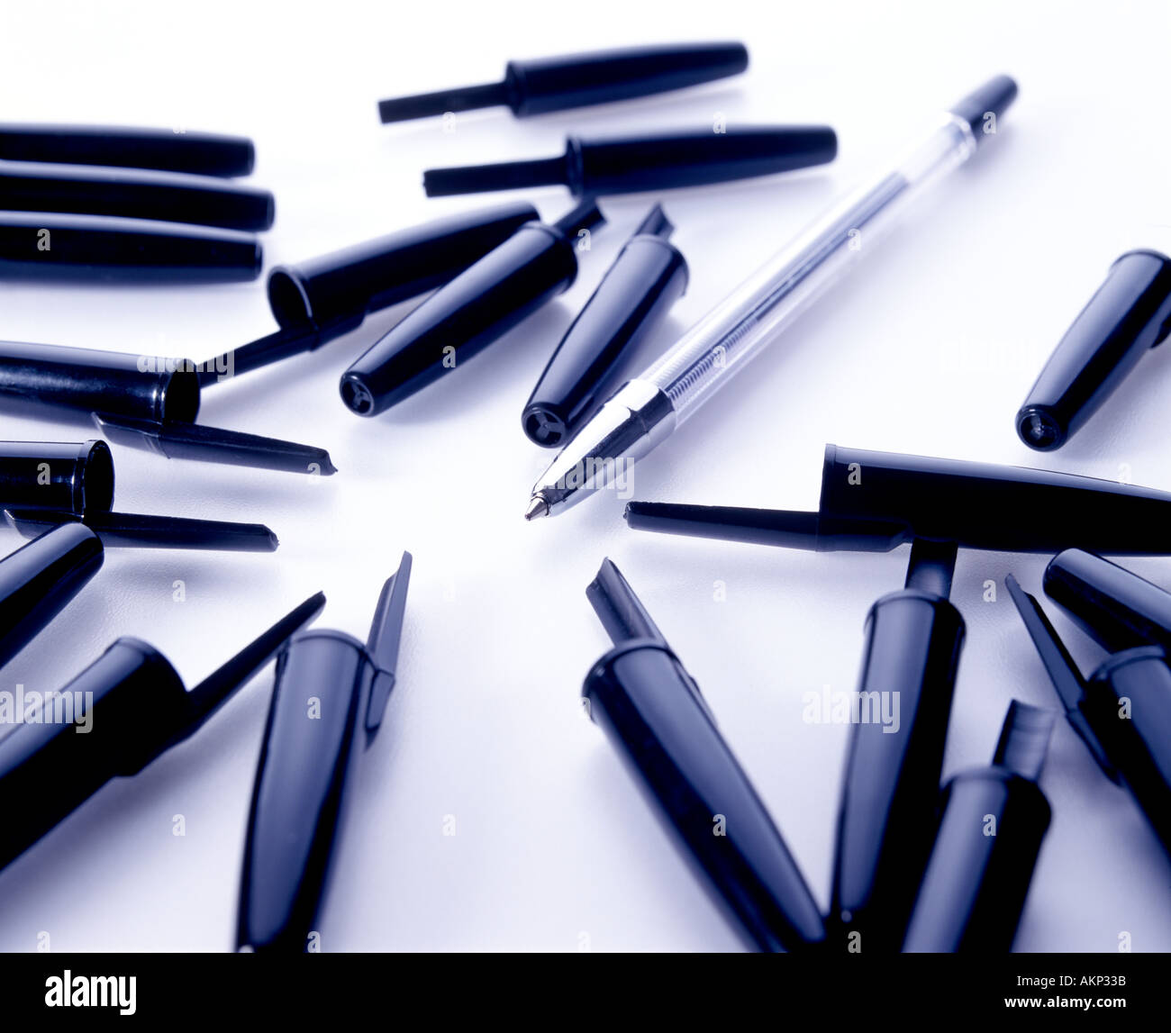 One black ball point writing pen without a cap in a row on white ...