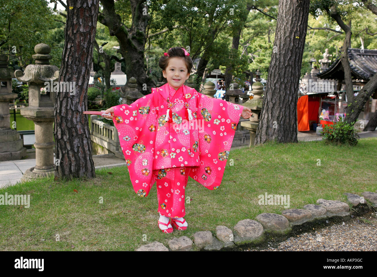 Cute Japanese Australian multicultural mixed race young girl dressed in ...