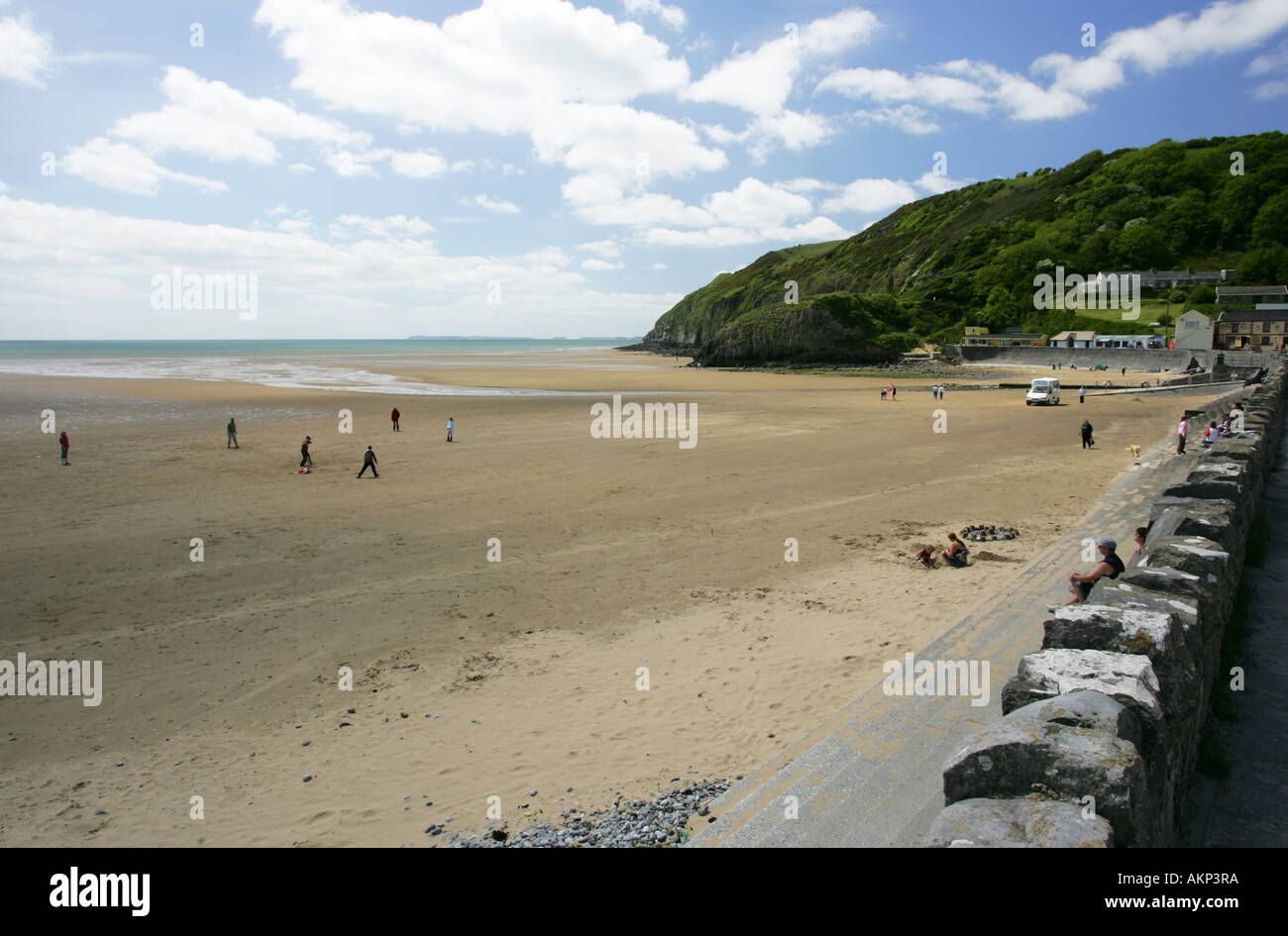 Tourists explore beautiful Pendine sands on the Pembrokeshire West ...