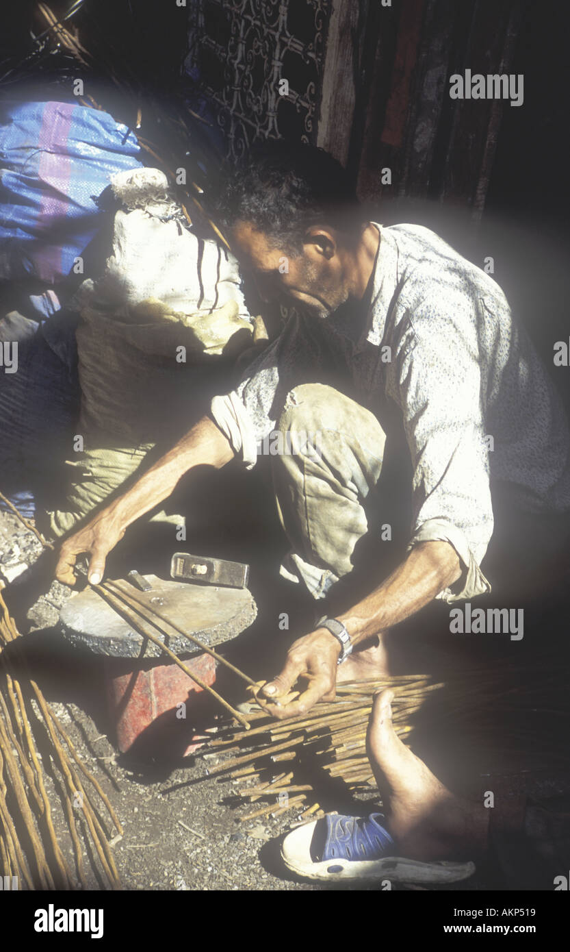 Hammering iron rods in the souq in Marrakesh Stock Photo - Alamy