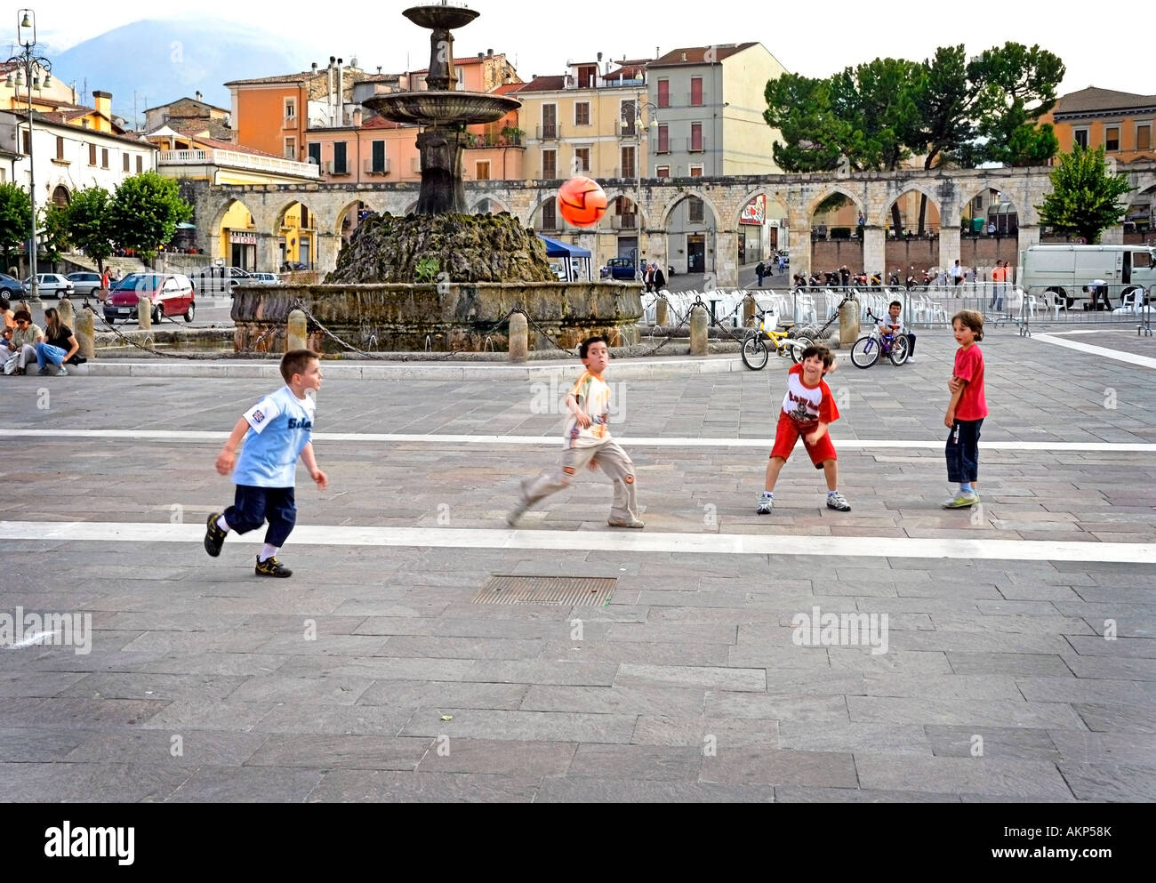 Boys playing football in Piazza Garibaldi, Sulmona, Abruzzo, Italy ...