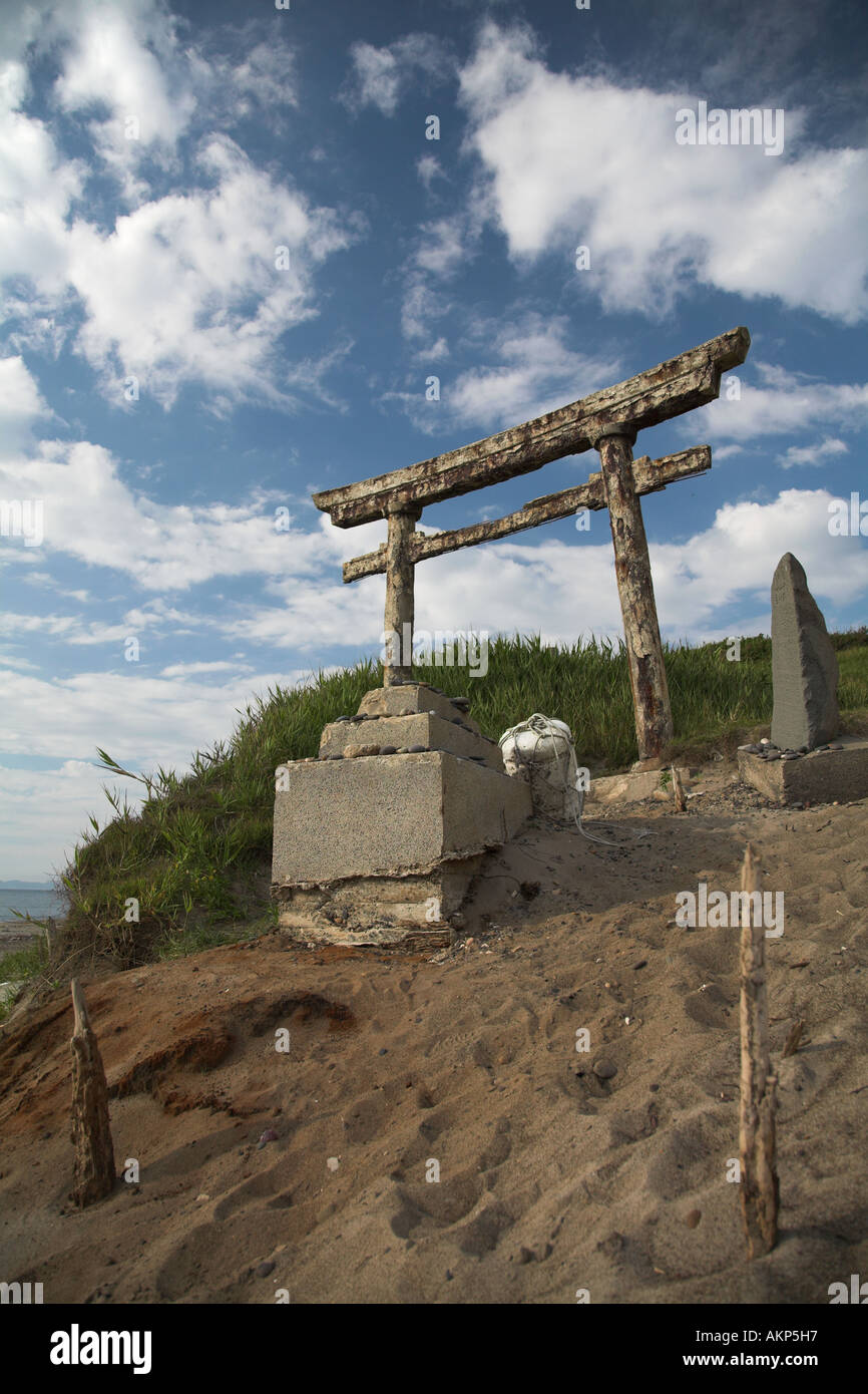old Torii shrine gate on a beach in northern Japan, Aomori Stock Photo ...