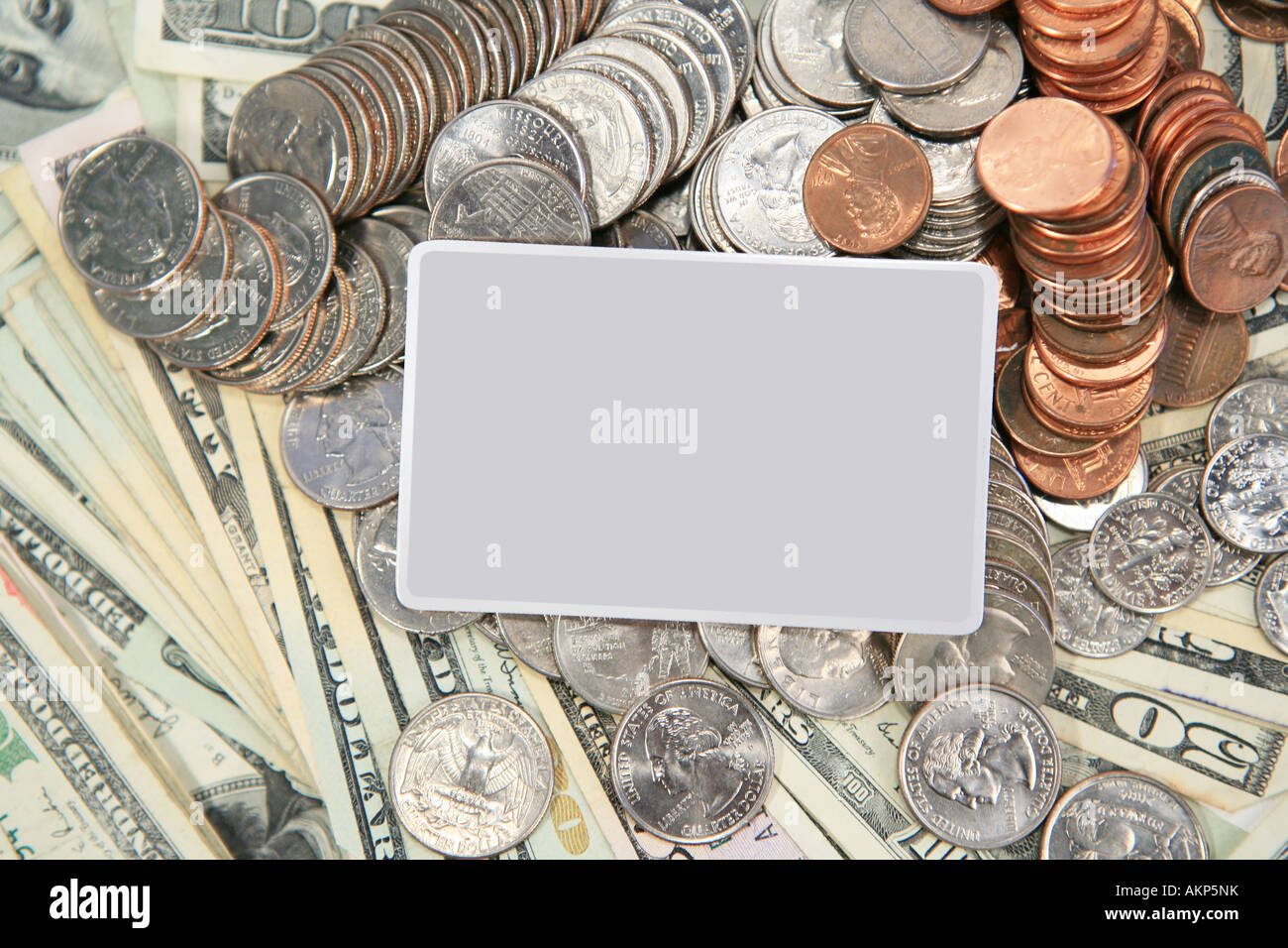 Blank gray credit card on pile of money Stock Photo - Alamy